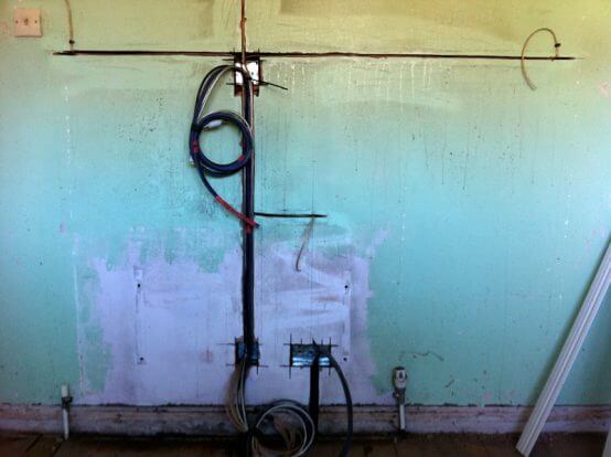 custom pre-wiring cable chase in brick | Custom Install